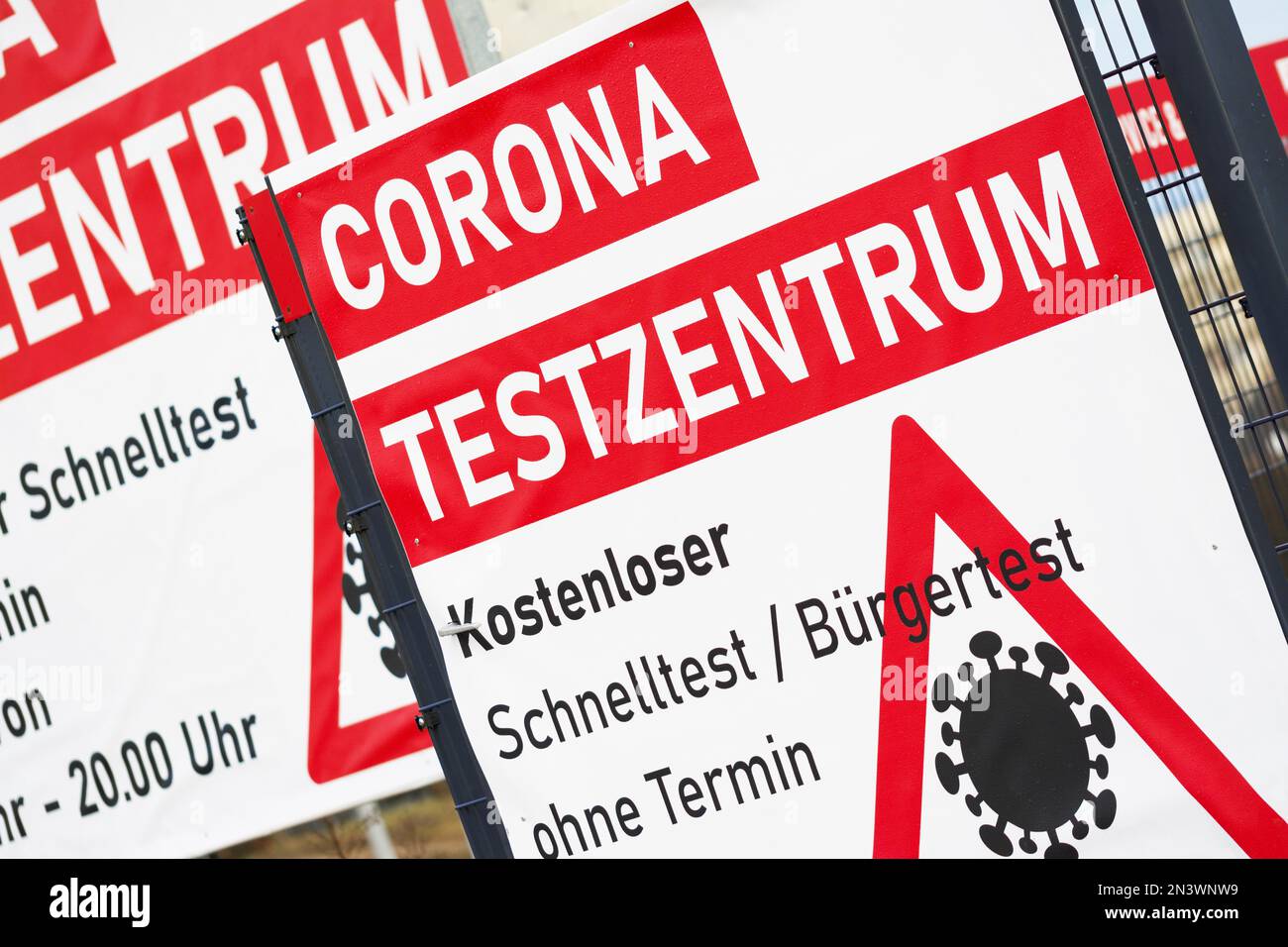 Advertising sign for Corona test centre Stock Photo - Alamy