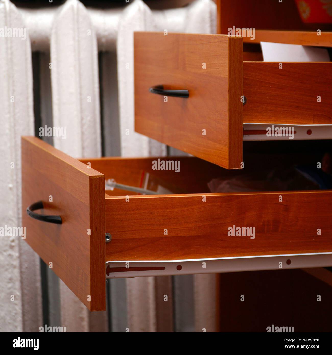 Open drawers of a wooden desk Stock Photo - Alamy