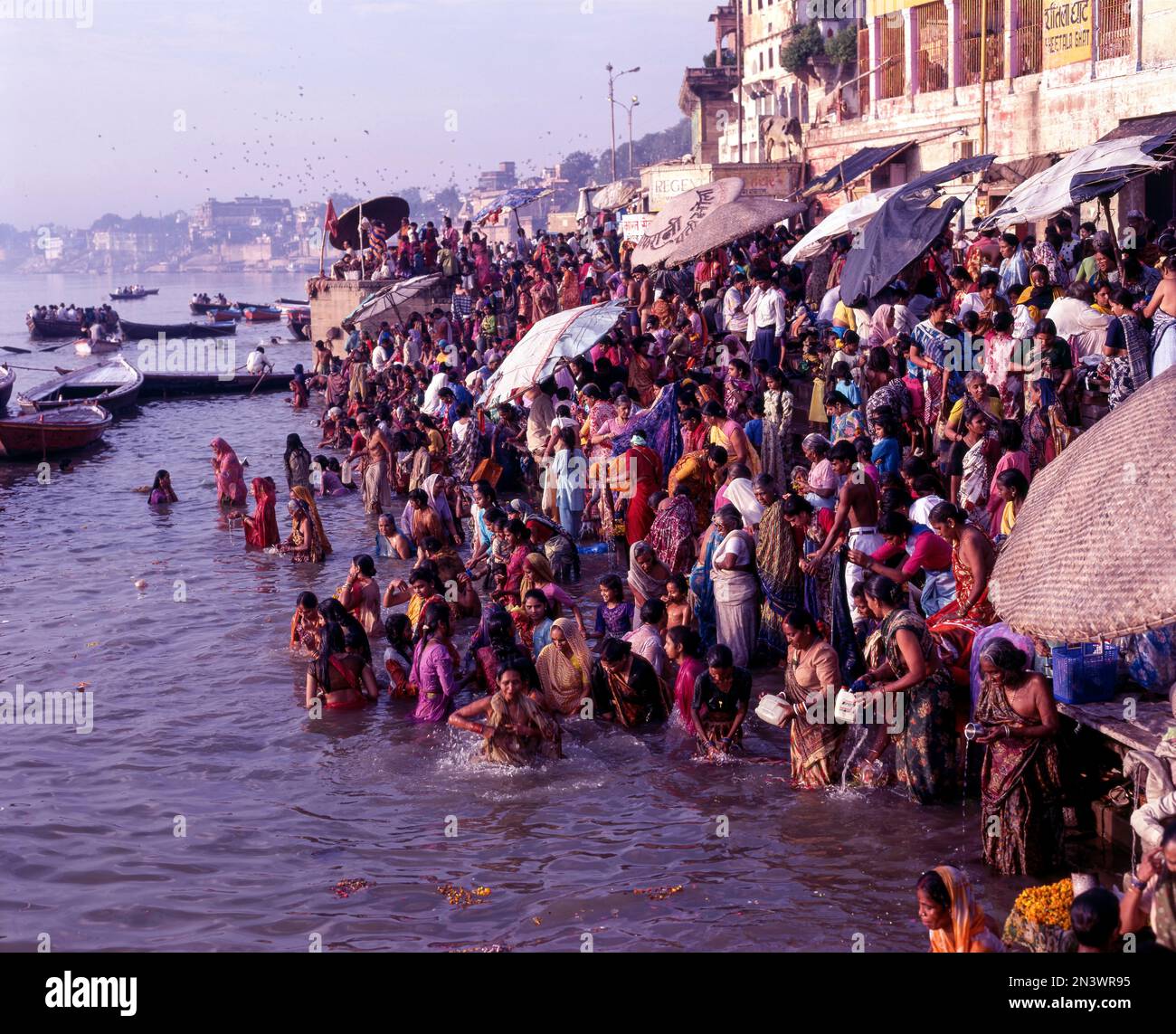 People perform ritual bath and puja prayers at ghats in the River ...