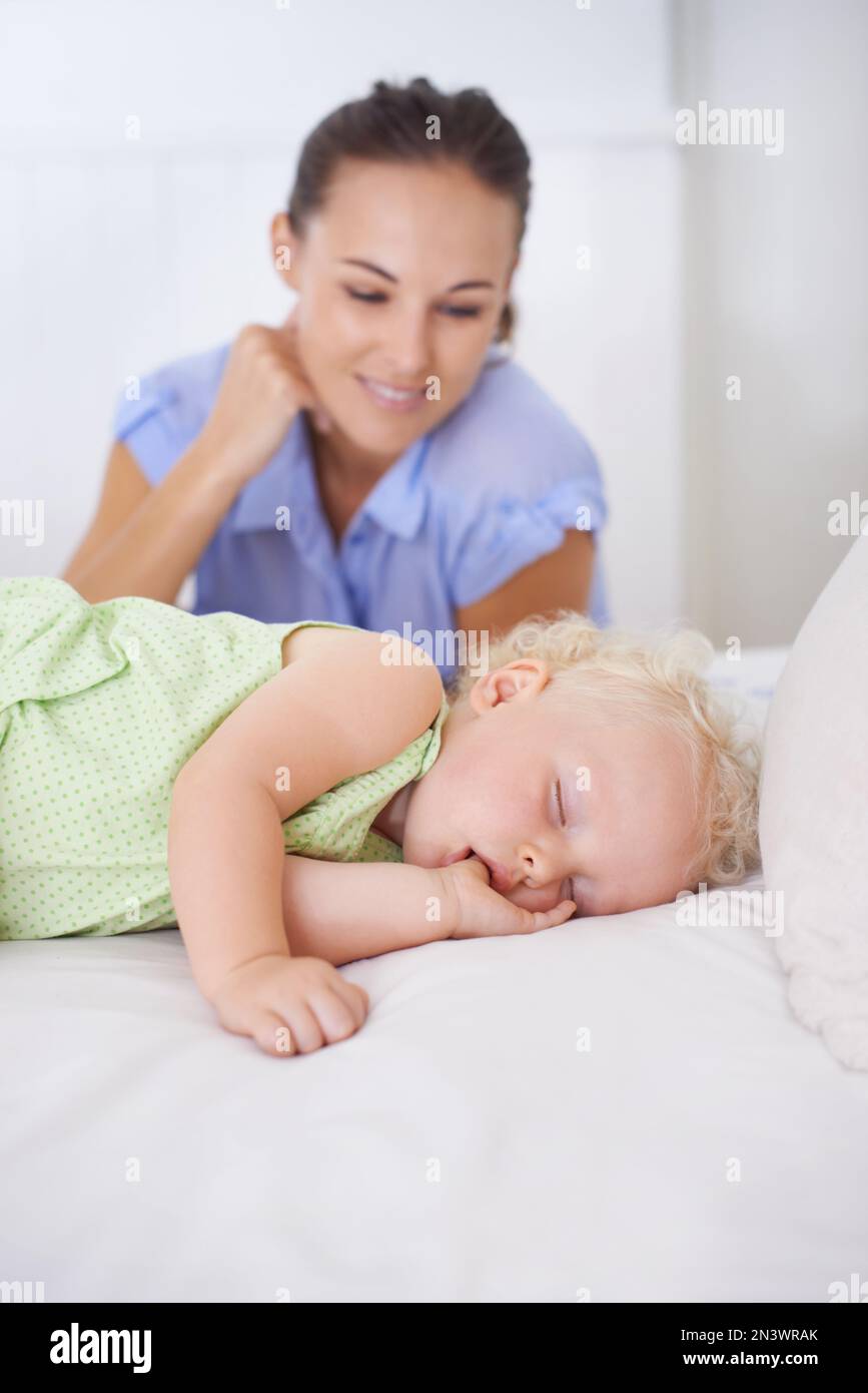 She looks so peaceful right now. A young mother watching over her ...