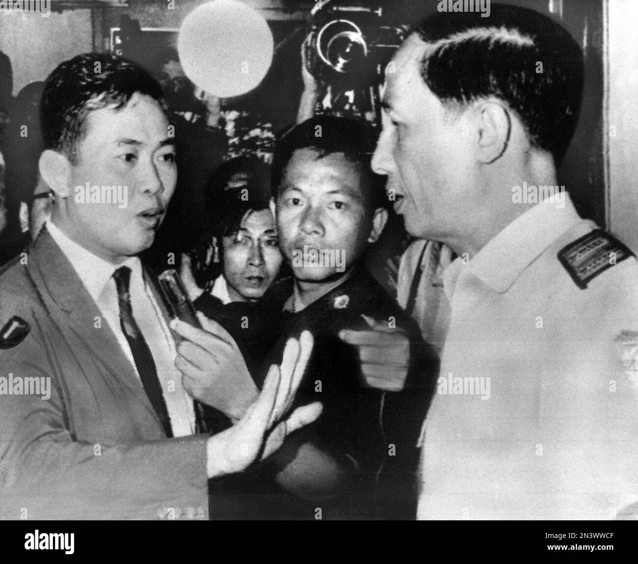 South Vietnamese Assemblyman Tran Ngoc Chau, left, argues with a Saigon police officer shortly ...