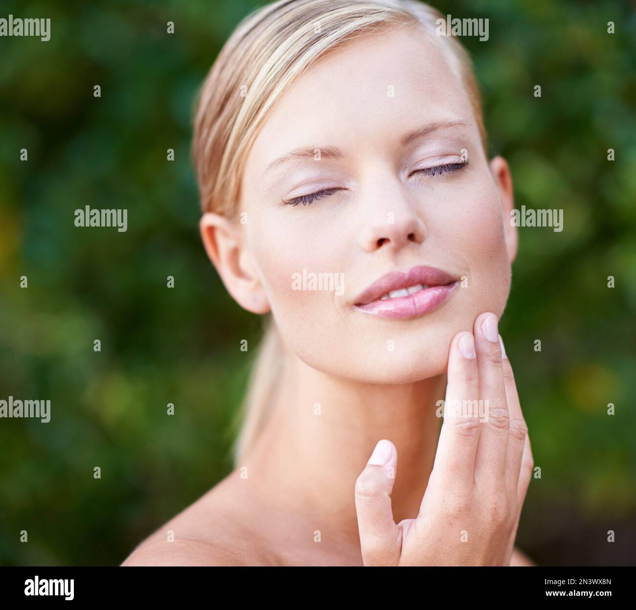 She cant keep her hands off of her soft skin. an attractive young woman ...