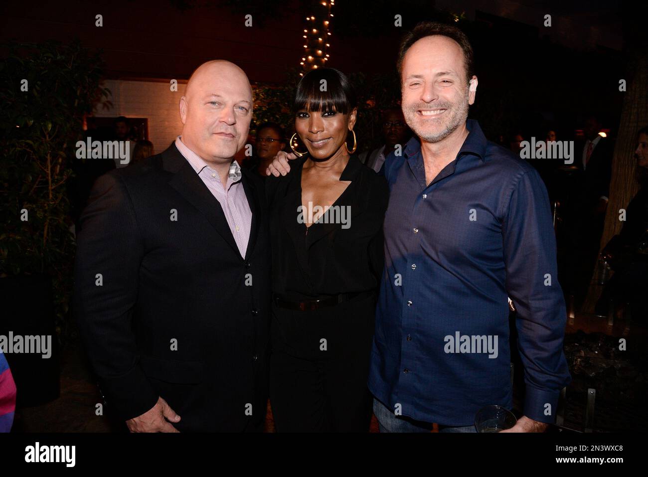 Actor Michael Chiklis, left, actress Angela Bassett, center, and FX CEO ...