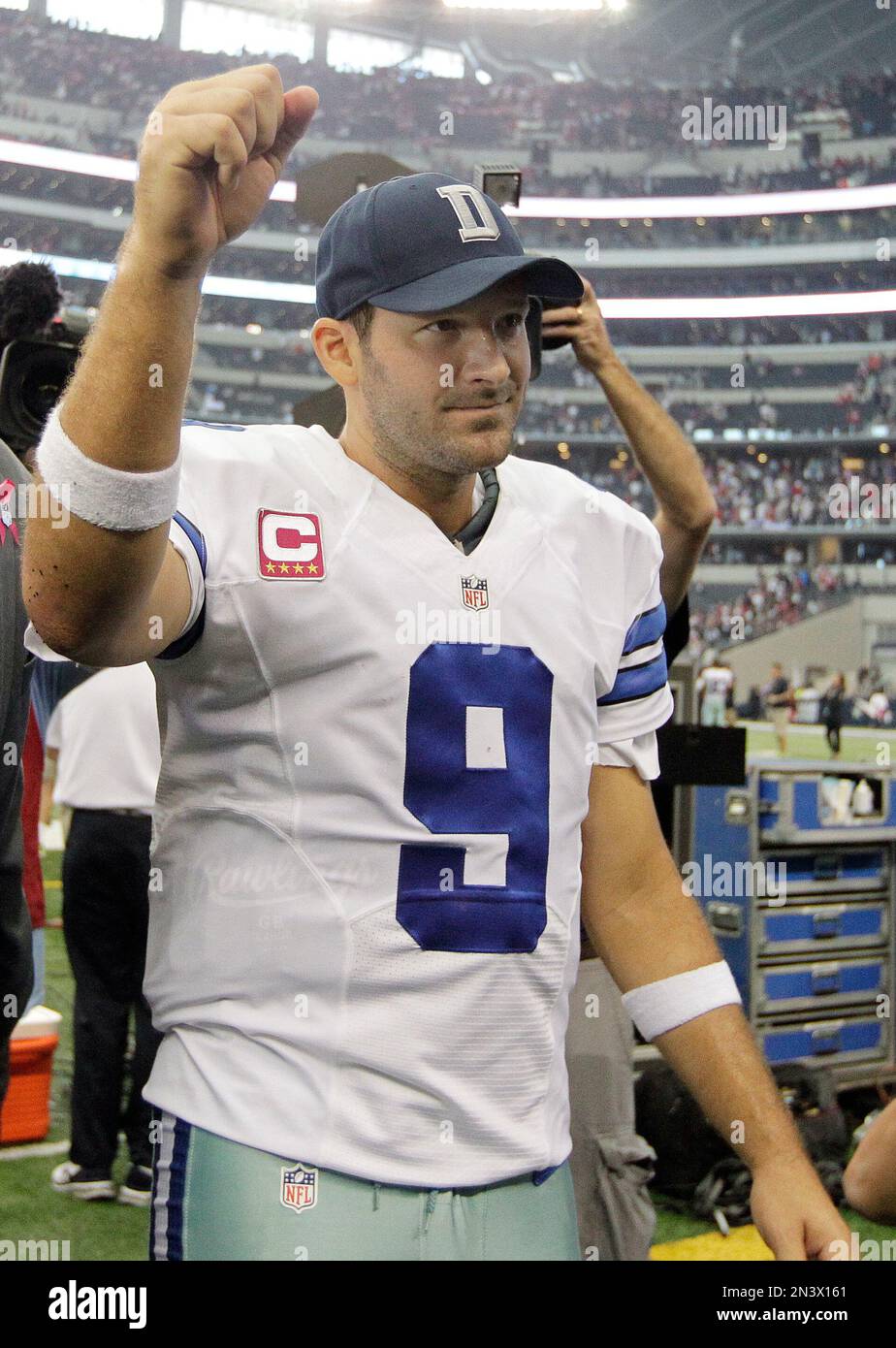 Dallas Cowboys quarterback Tony Romo (9) celebrates a 20-17 overtime ...