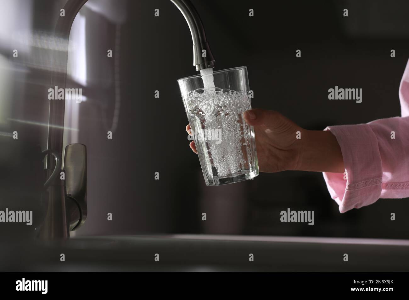 Woman pouring filtered water glass hi-res stock photography and images ...