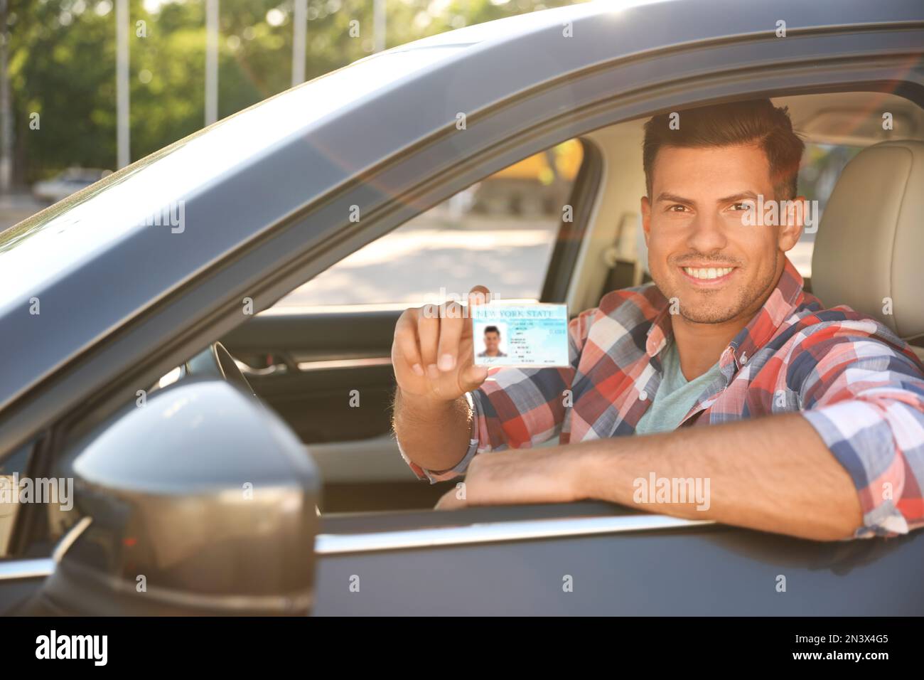 Man holding driving license hi-res stock photography and images - Alamy