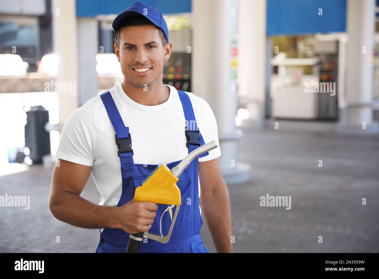 Happy petrol pump worker hi-res stock photography and images - Alamy