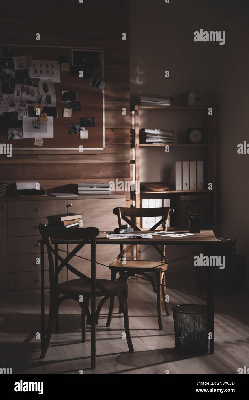 Detective office interior with evidence board on wall Stock Photo - Alamy