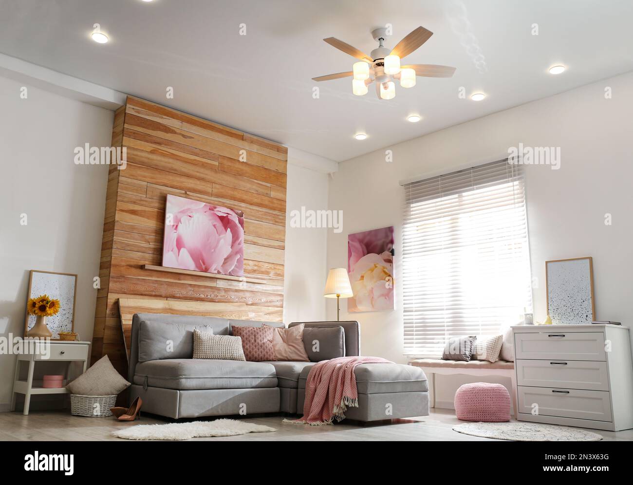 Stylish living room interior with modern ceiling fan and comfortable ...