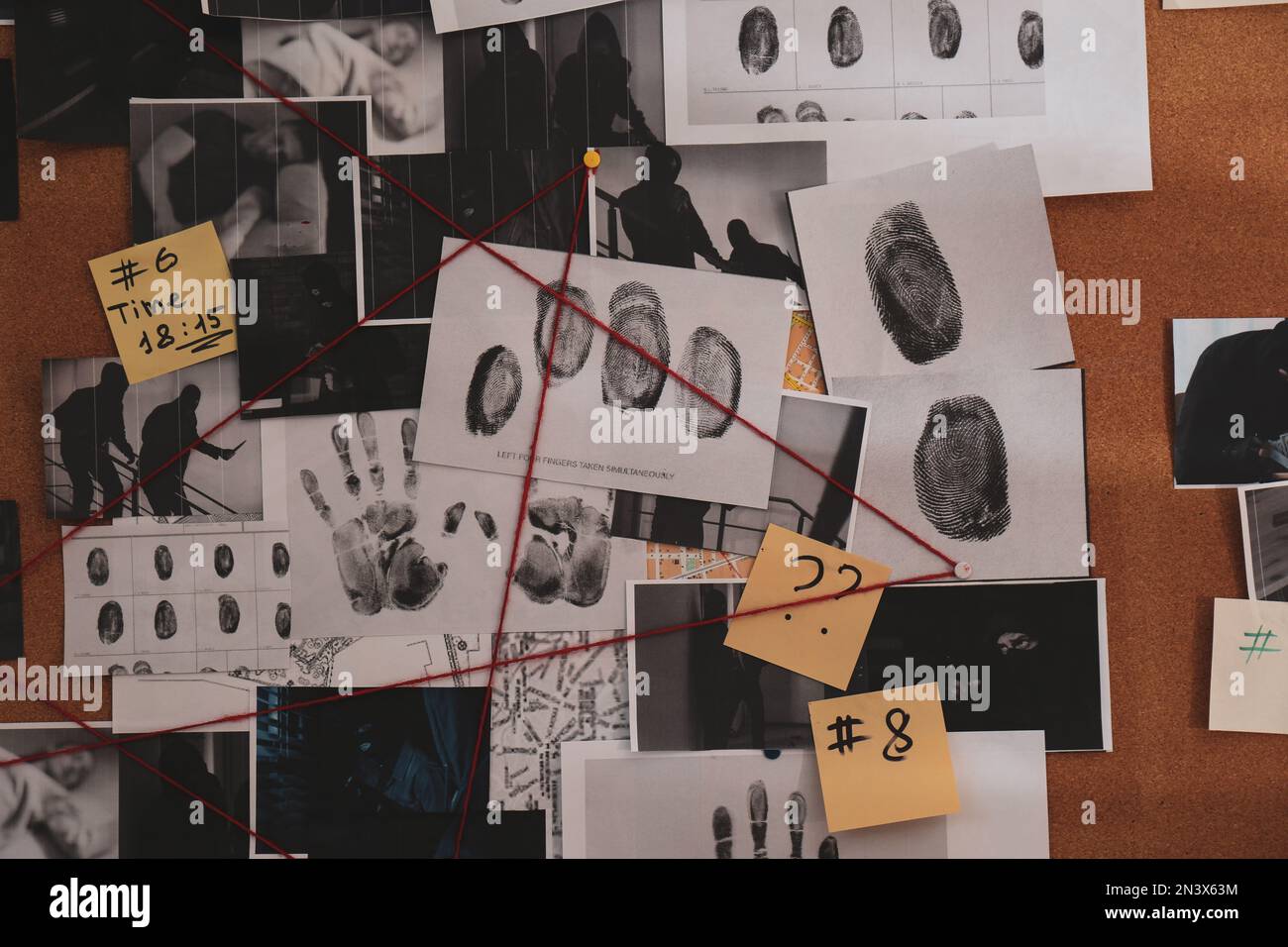 Detective board with crime scene photos, stickers, clues and red thread ...