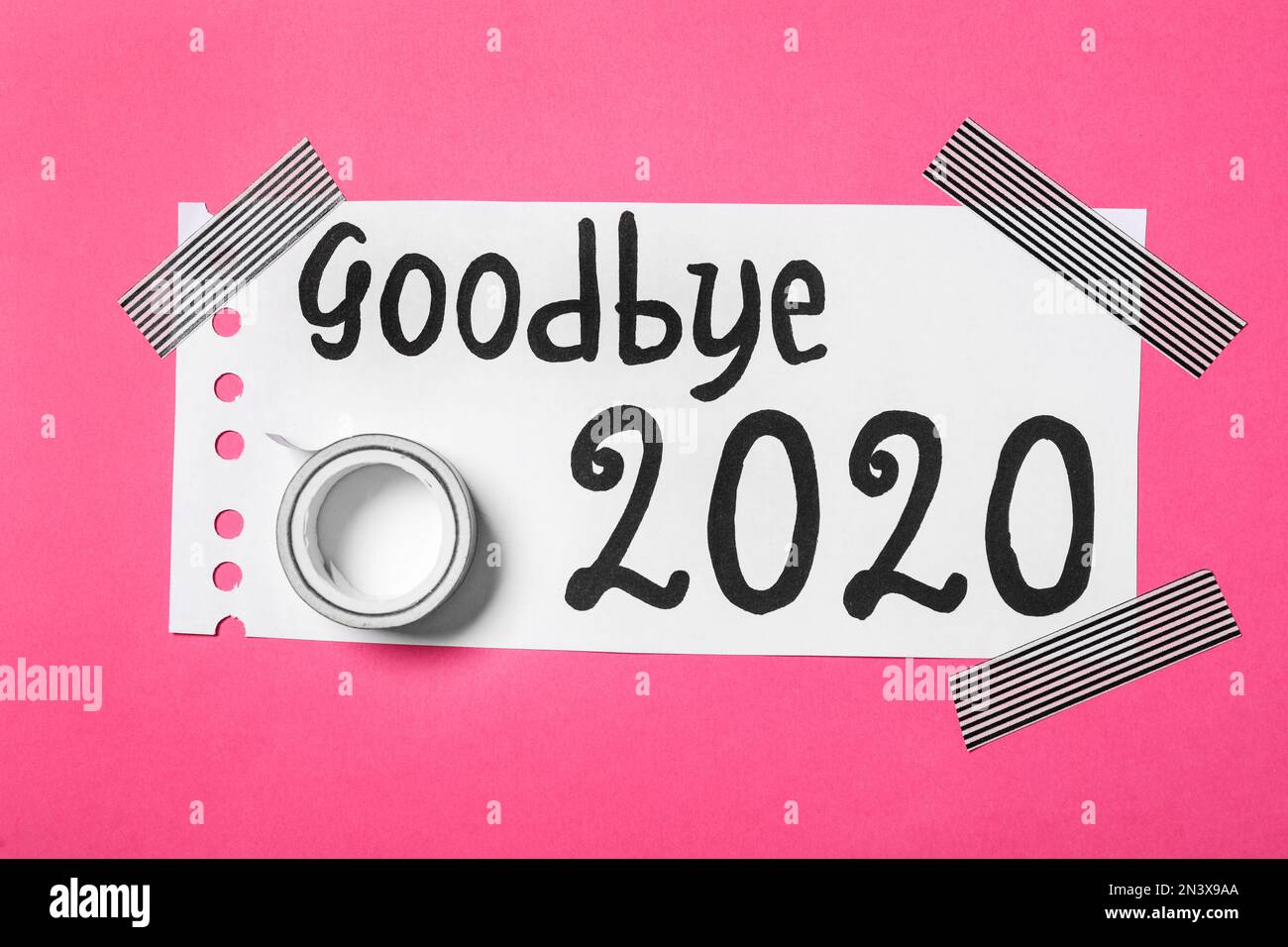Paper with text Goodbye 2020 and adhesive tape on pink background, top ...