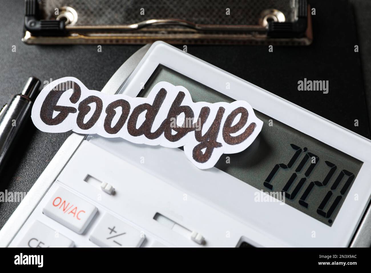 Phrase Goodbye 2020 formed of word cut from paper and digits on ...