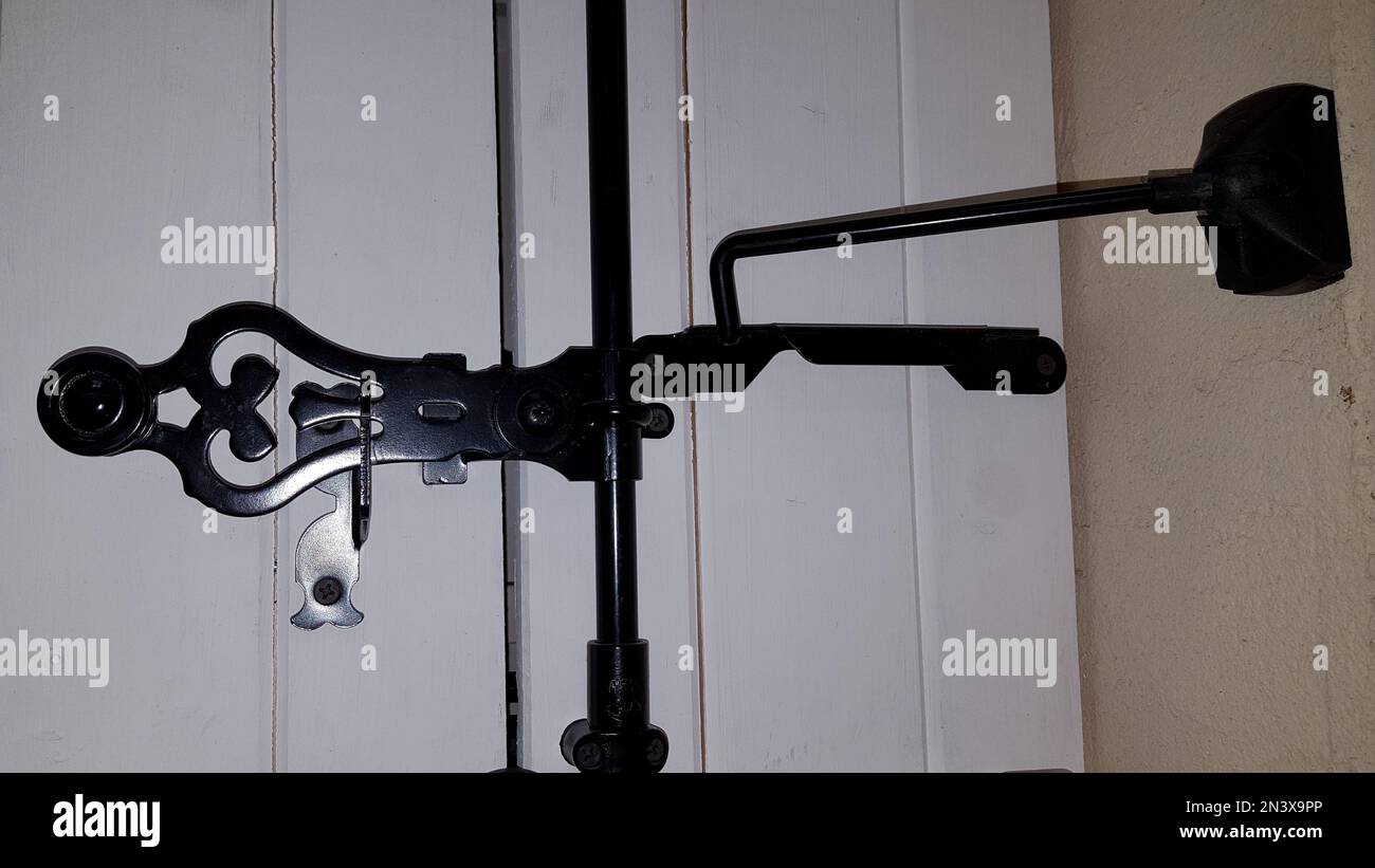 white shutter handle window black closing system Stock Photo - Alamy