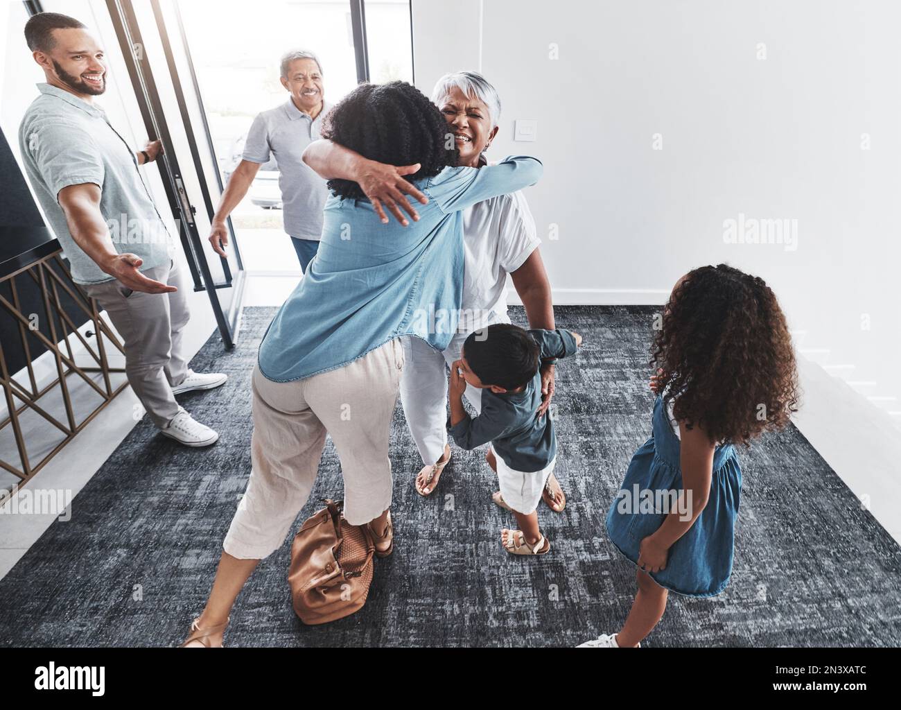 Welcome, family hug and home of a mother, grandparents and children ...