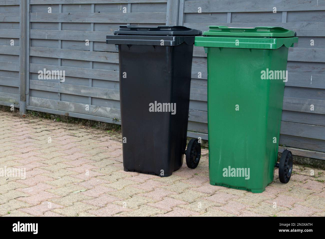Collected kerbside waste bins on street Stock Photo - Alamy