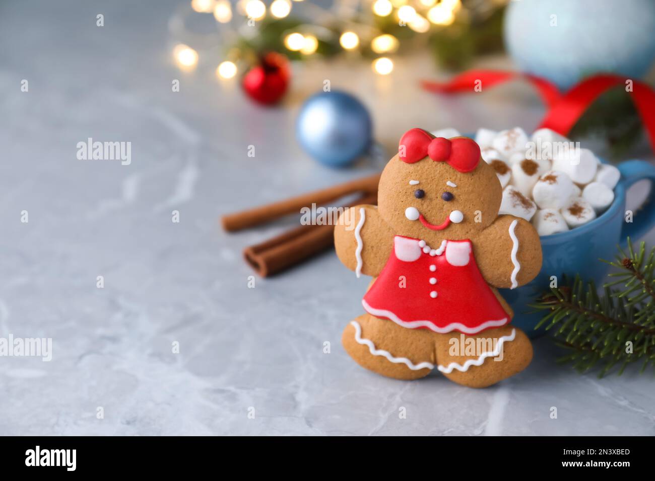 Gingerbread girl on grey marble table. Space for text Stock Photo - Alamy