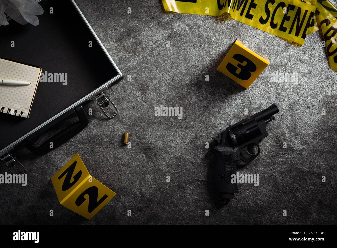 Evidences and crime scene markers on grey stone background, flat lay ...