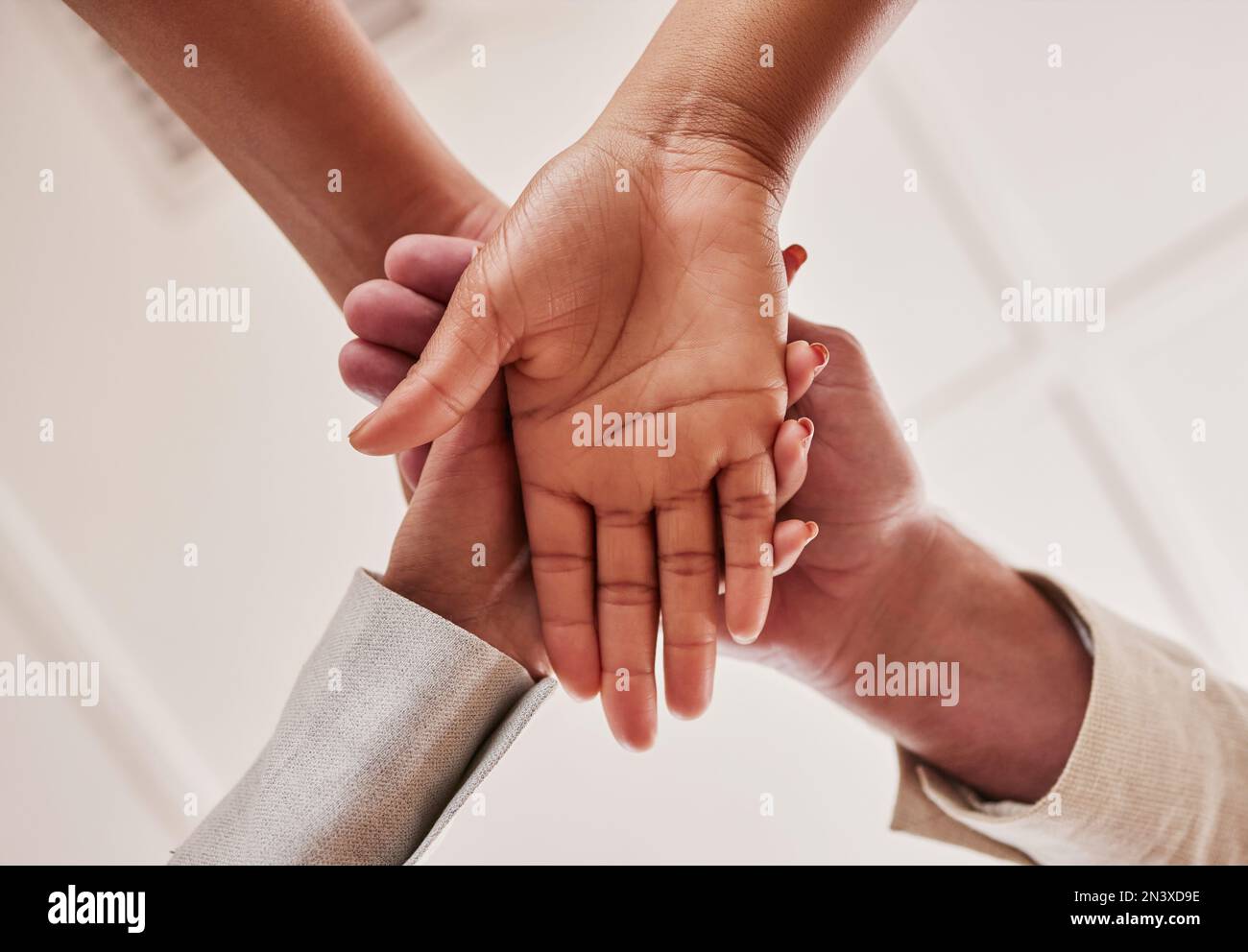 People, hands together and unity below in trust for community ...