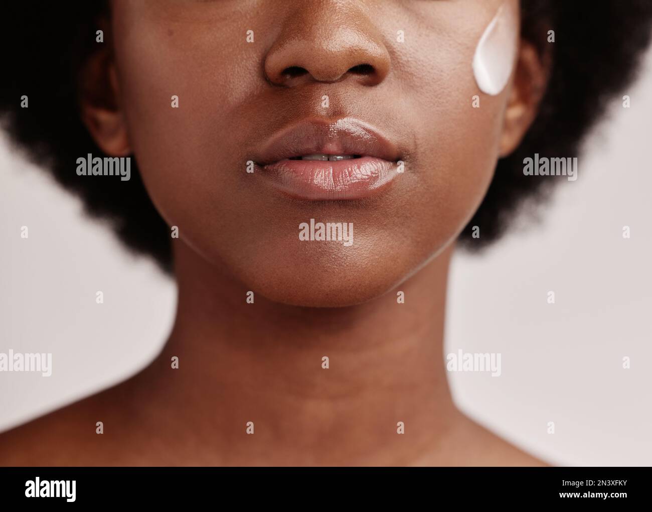 Black woman, face and cream of a model with facial mask, skincare and ...