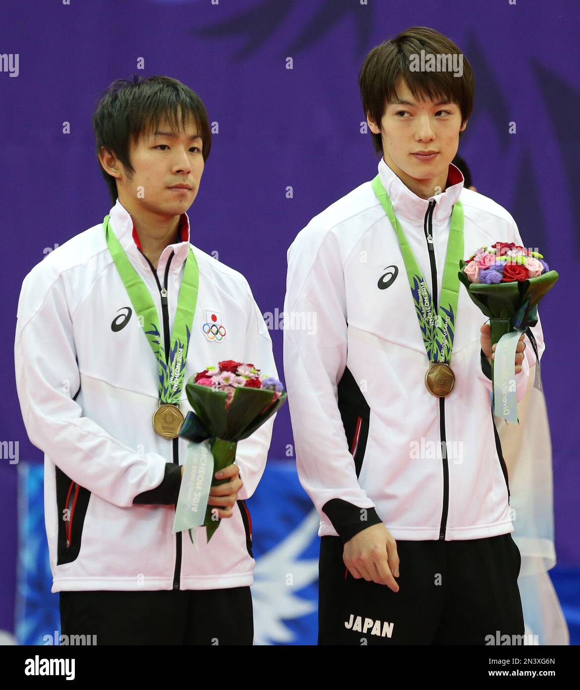 Bronze medallists Japan’s Koki Niwa, left, and Kenta Matsudaira stand ...