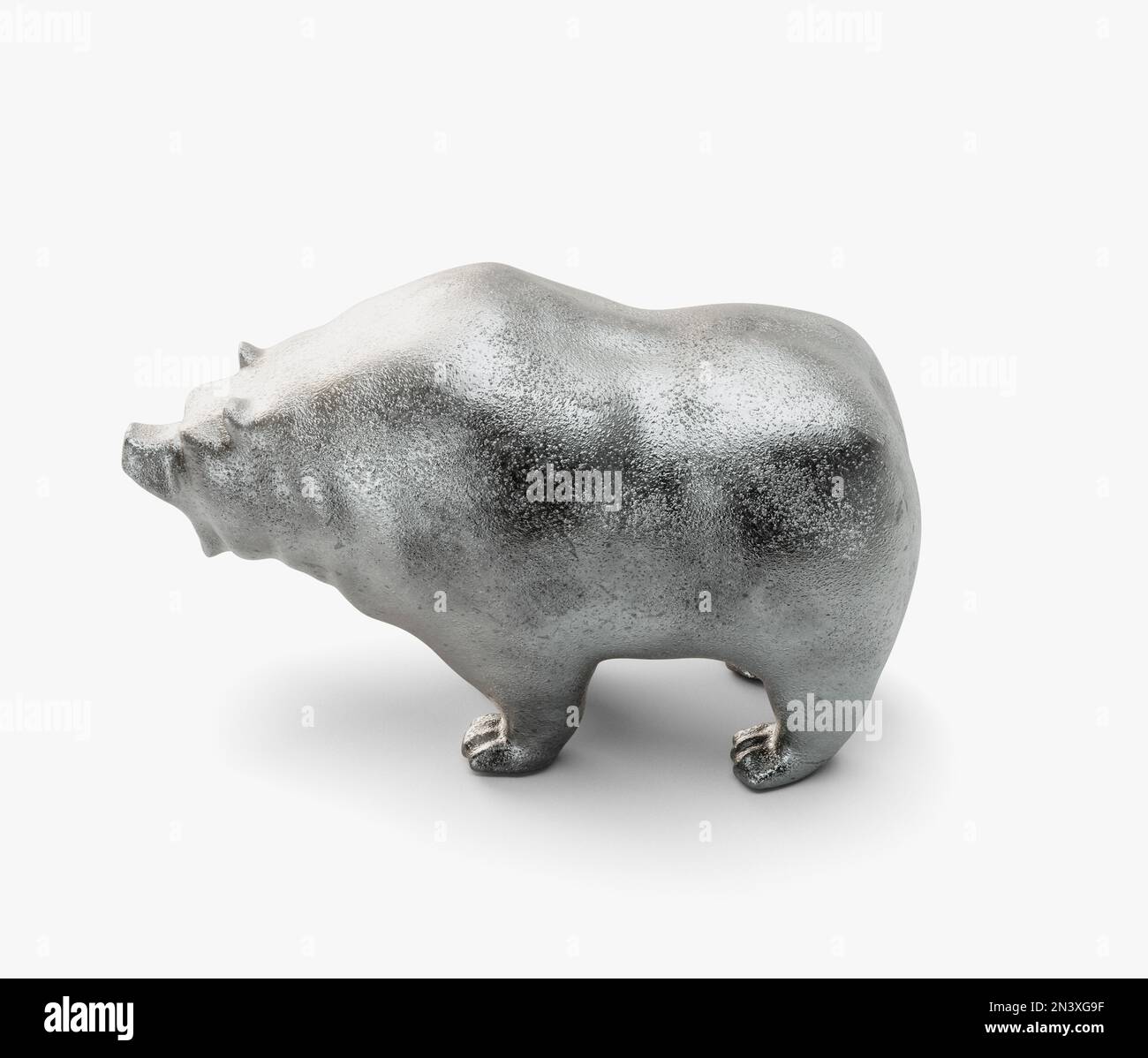 A token statuette depicting a silver bear on an isolated dark ...