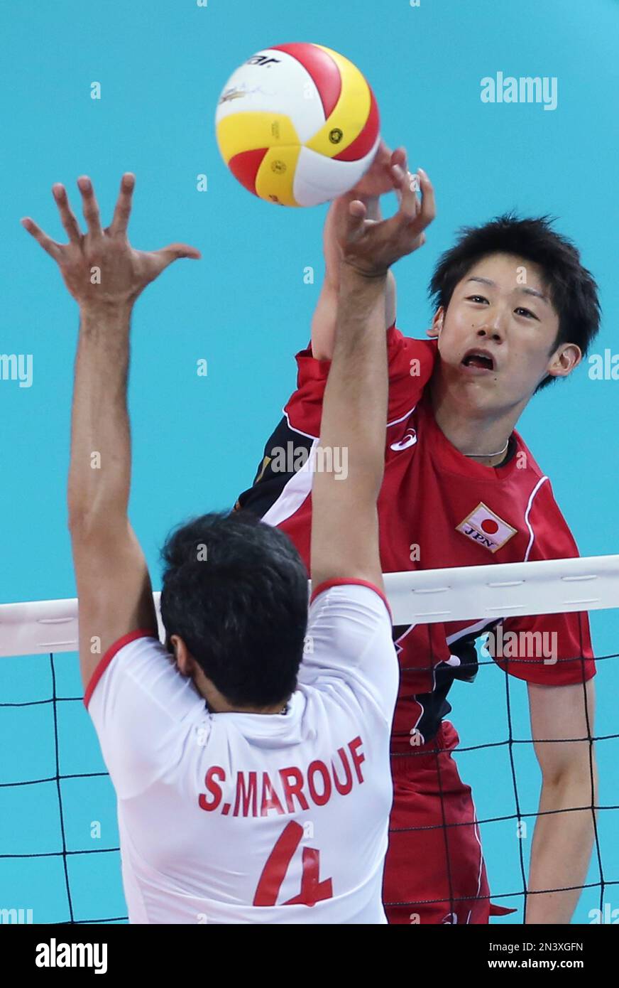 Japan's Yuki Ishikawa spikes against Iran's Seyed Mohammad Mousavi ...