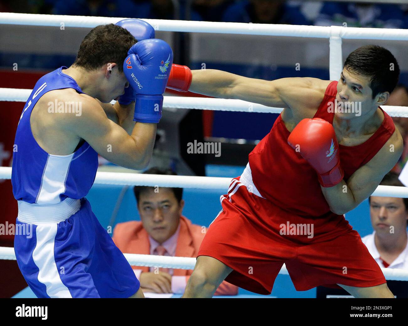 Kazakhstan's Daniyar Yeleussinov, right, competes against Uzbekistan's ...