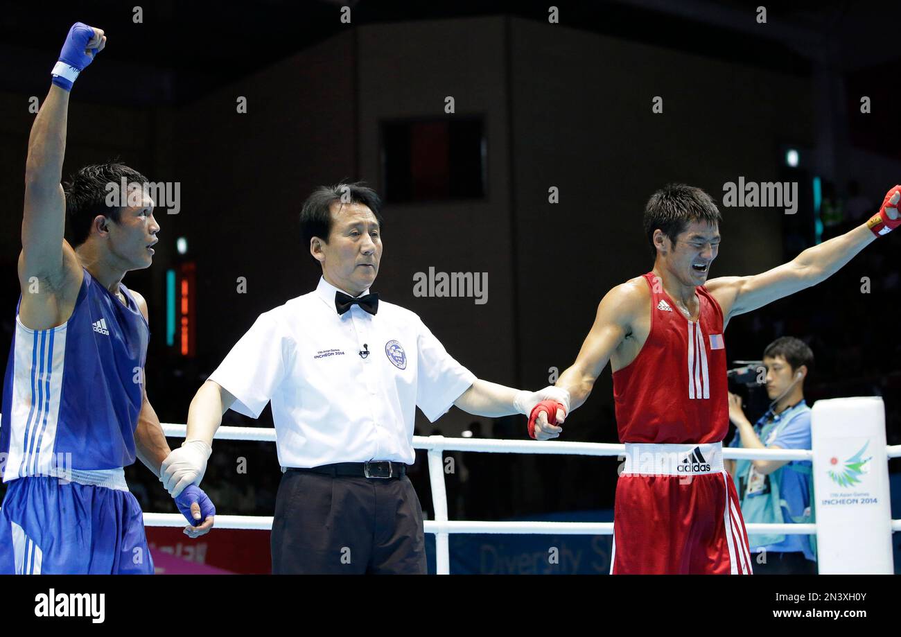 Mongolia's Otgondalai Dorjnyambuu, right, celebrates after defeating ...