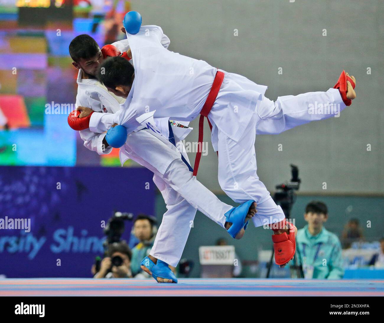 Senthil Kumaran Silvarajoo, left, of Malaysia competes against Suryadi ...