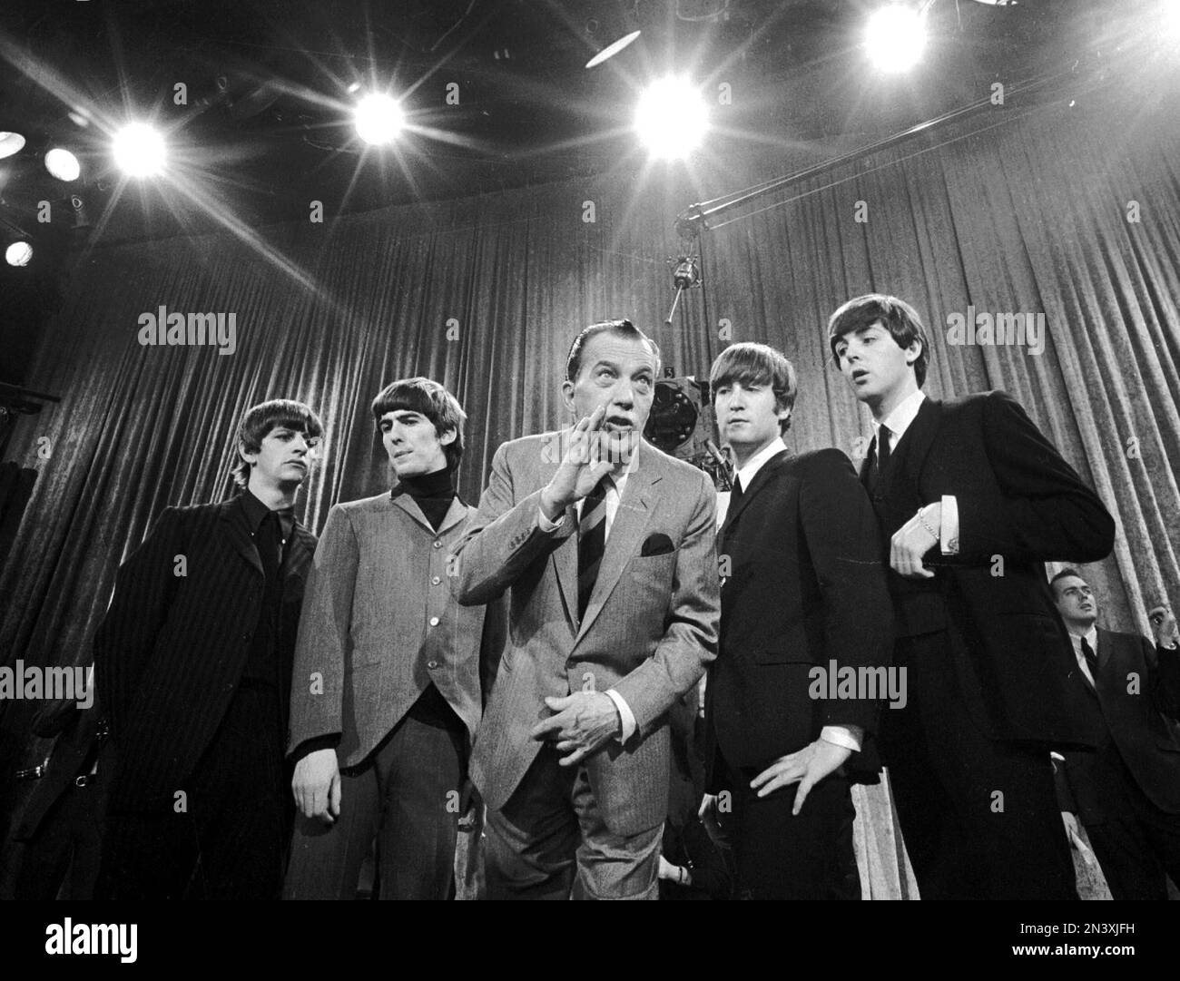 Ed Sullivan, center, stands with The Beatles, from left, Ringo Starr ...