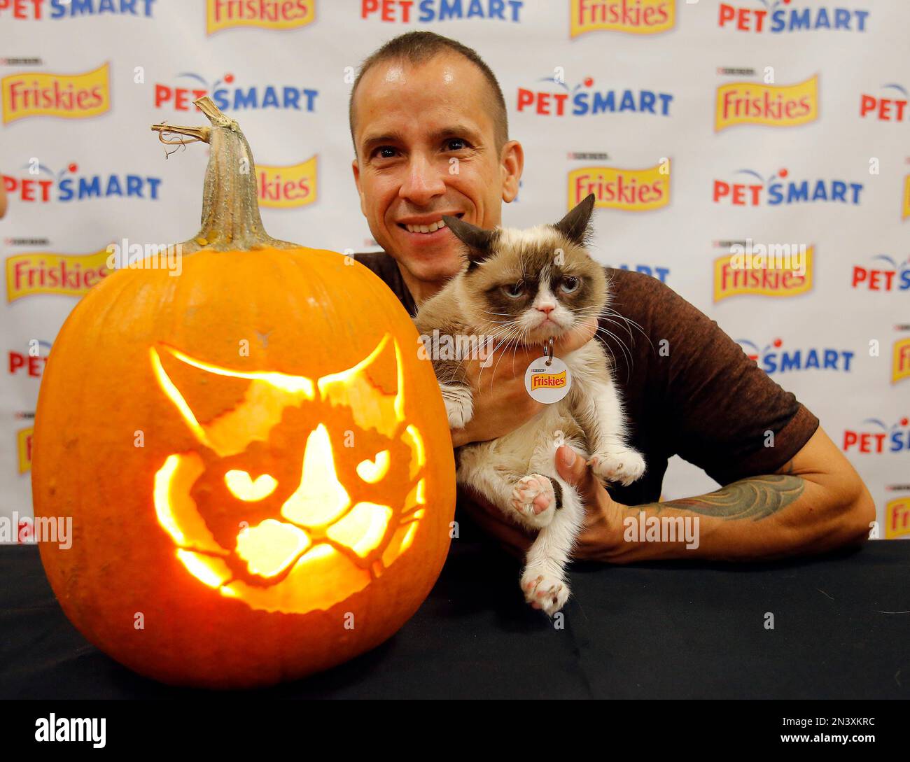 IMAGE DISTRIBUTED FOR FRISKIES - Grumpy Cat comes face-to-face with the first-ever Grump-O ...