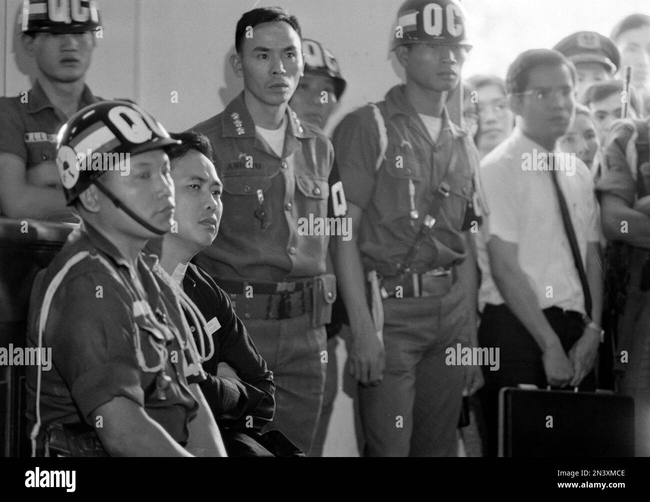 Wearing the black pajamas of a prisoner, South Vietnamese Deputy Tran ...