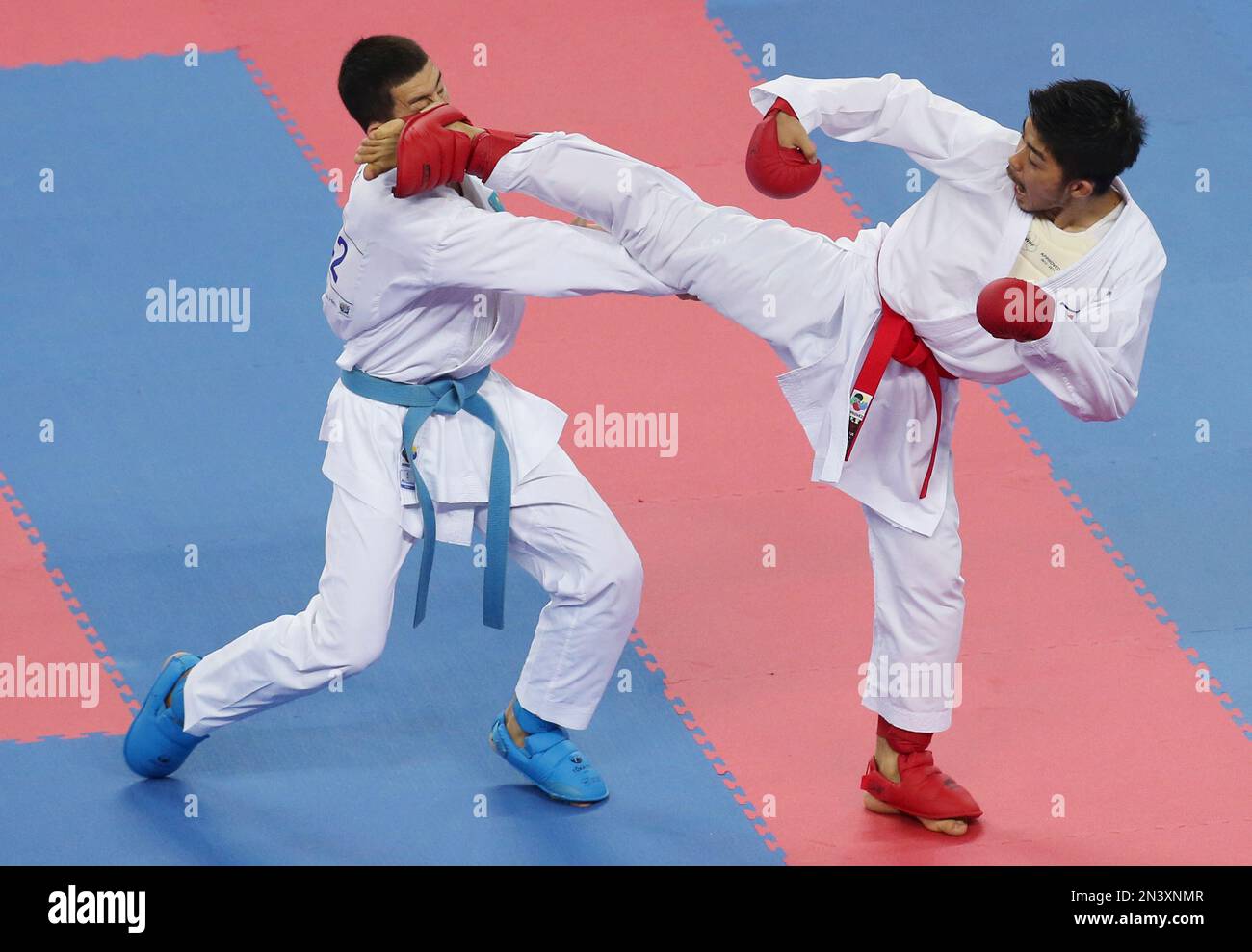 Japan's Hiroto Shinohara, right, kicks Kazakhstan's Sagandykov Rinat ...