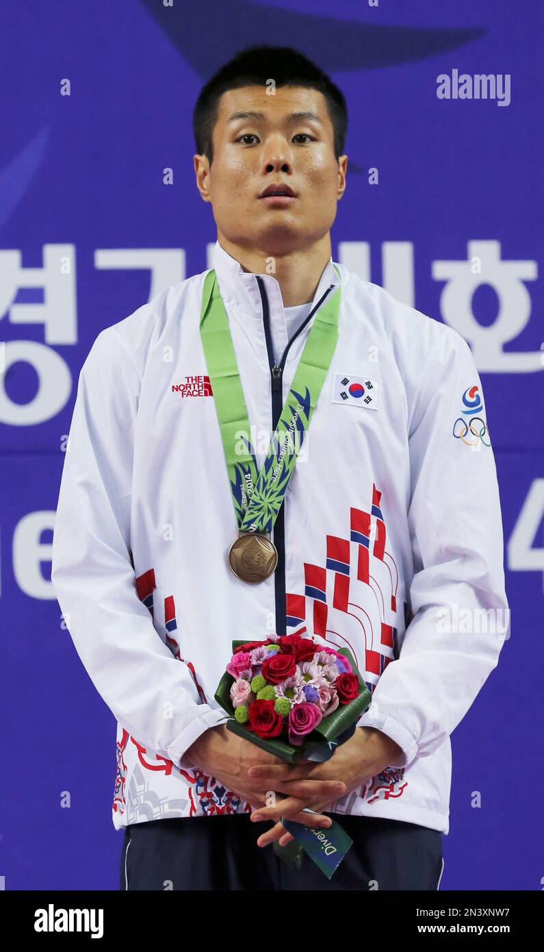 Bronze medalist Kim Do-won of South Korea stands with his medal at the ...