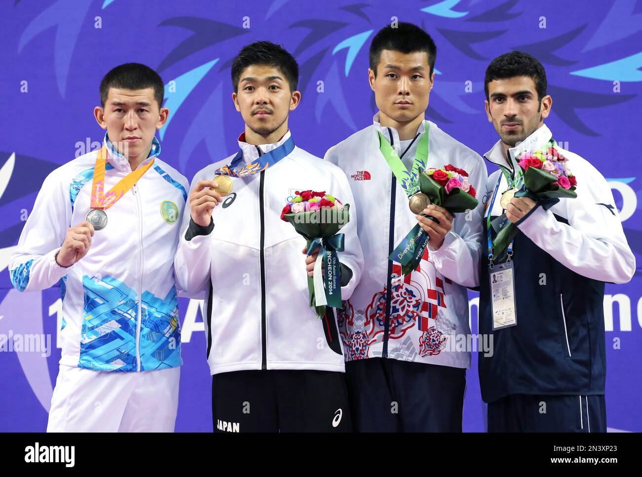 From left, silver medalist Sagandykov Rinat of Kazakhstan, gold ...