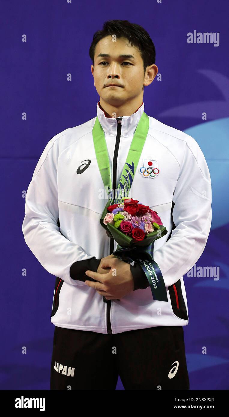 Japan's Issei Shimbaba stands at the podium with his bronze medal ...