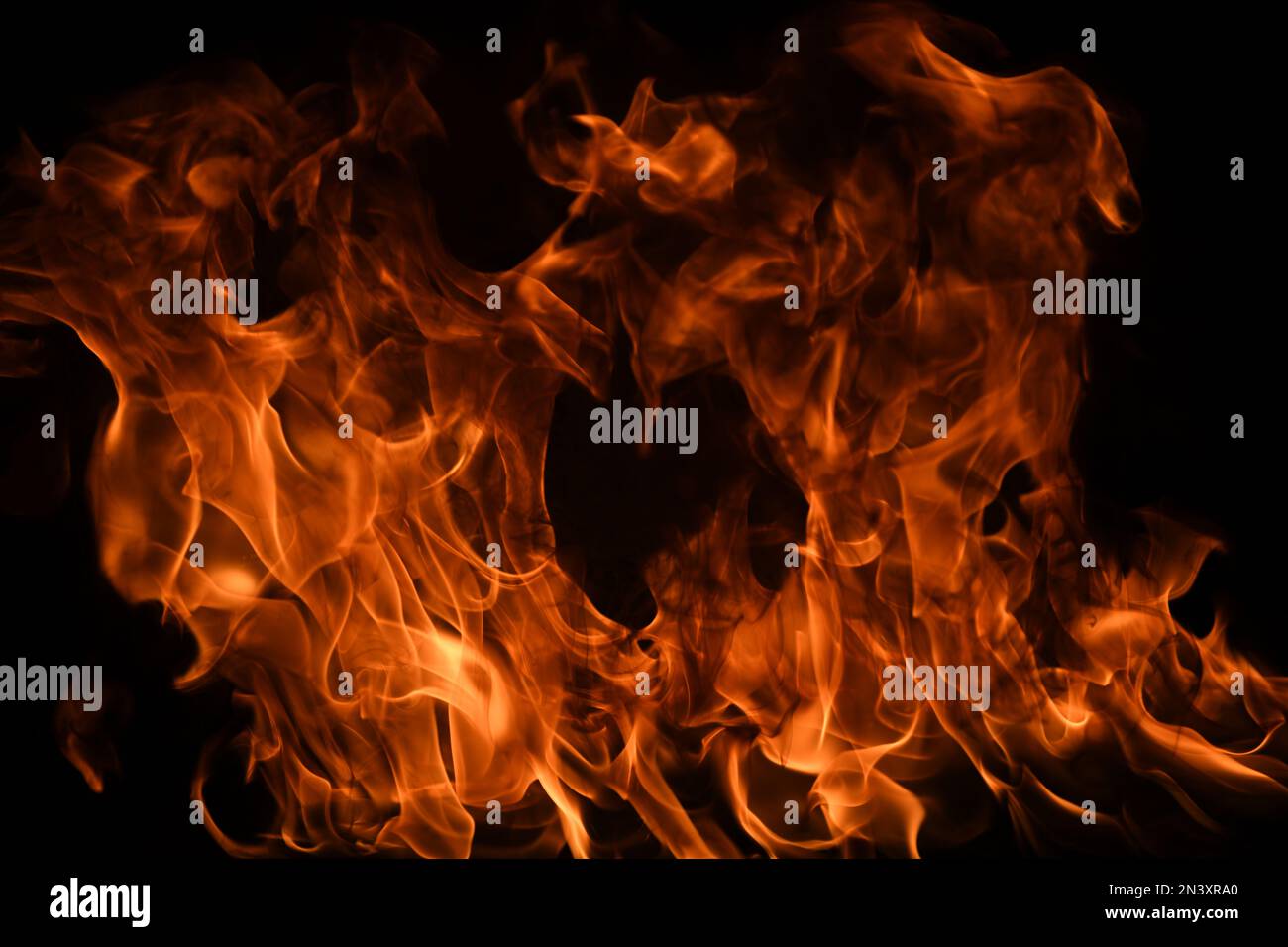 Blaze burning fire flame on art texture background Stock Photo - Alamy