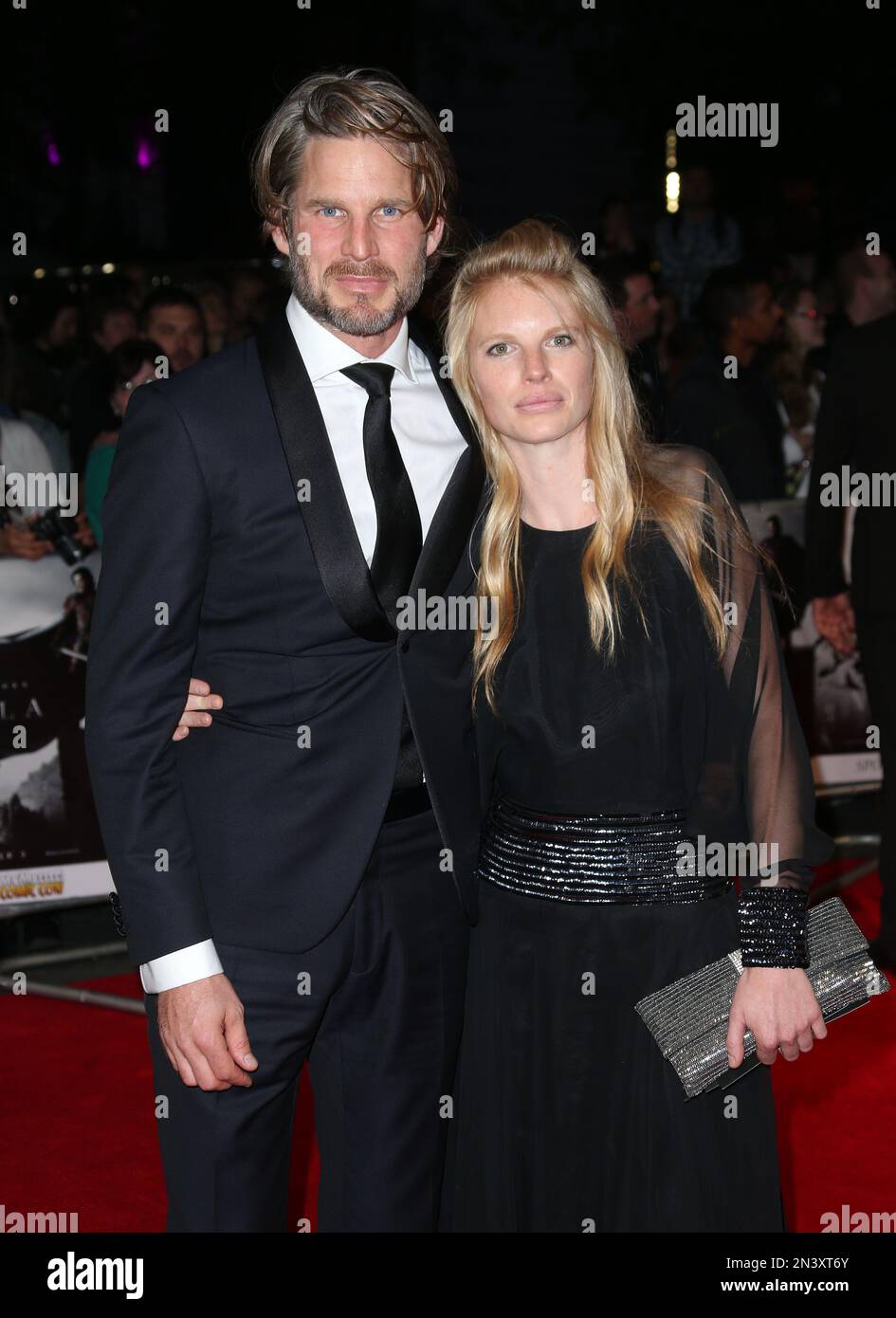 Noah Huntley poses for photographers as they arrive for the premiere of ...