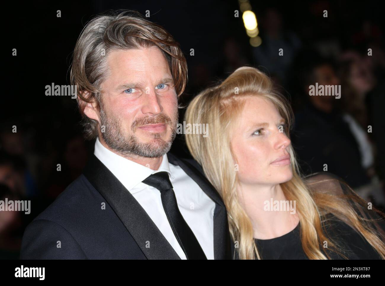 Noah Huntley poses for photographers as they arrive for the premiere of ...