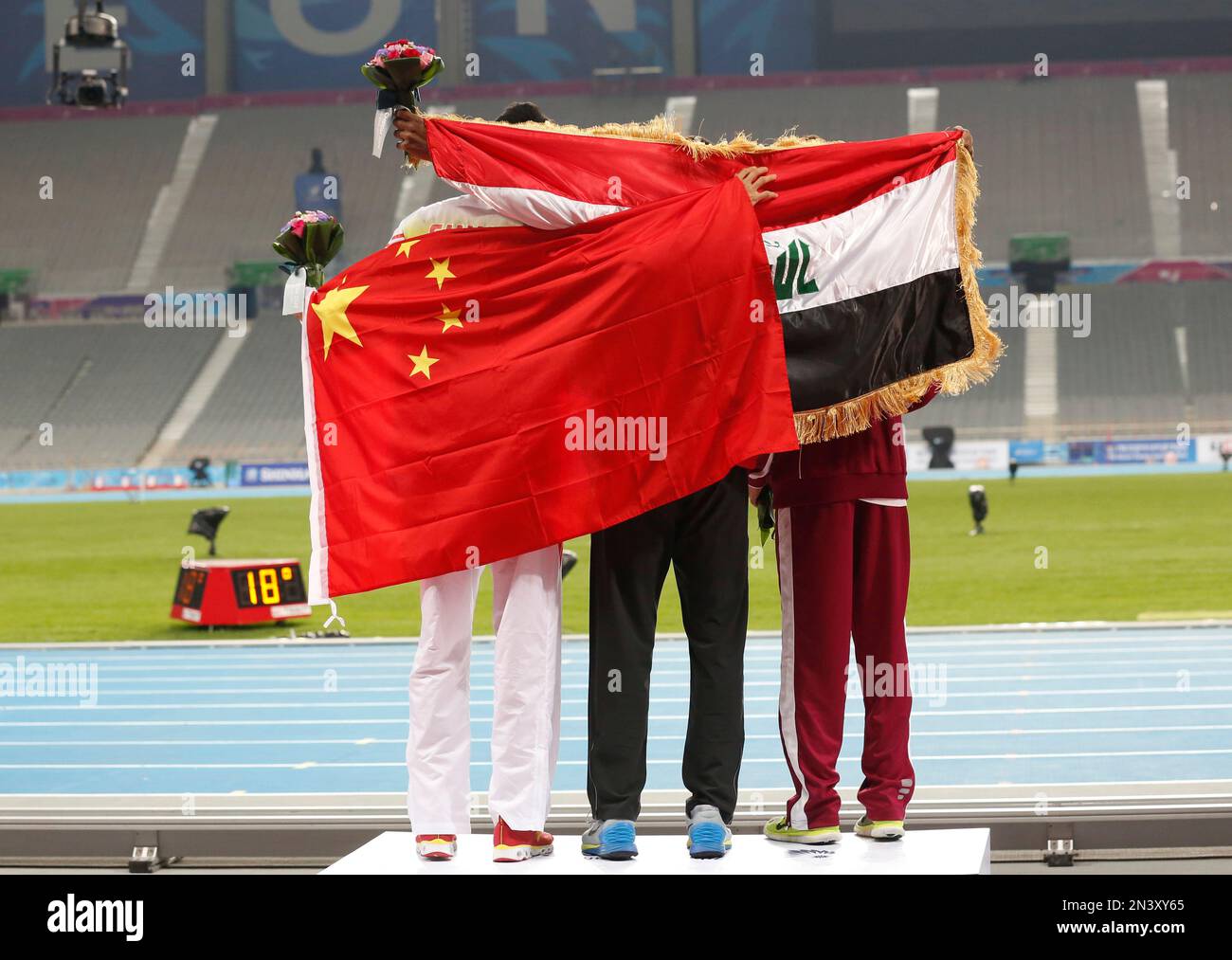 From left, silver medal winner China's Teng Haining, gold medal winner ...