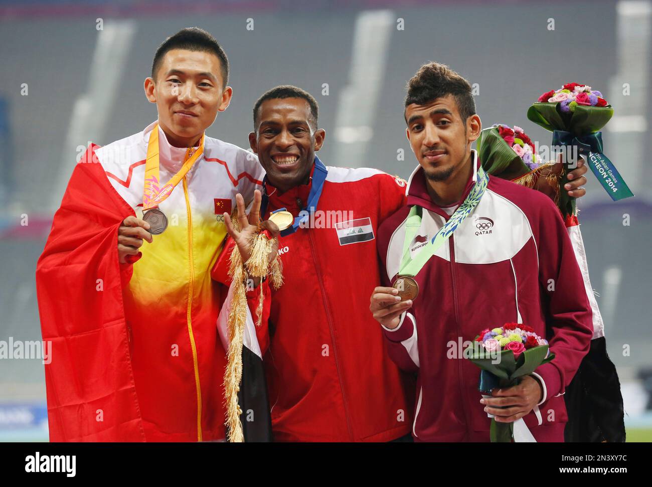 From left, silver medal winner China's Teng Haining, gold medal winner ...