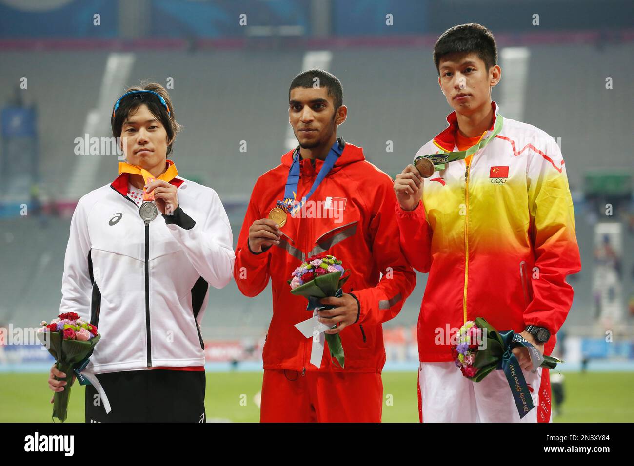 From left, silver medal winner Japan's Takayuki Kishimoto, gold medal ...