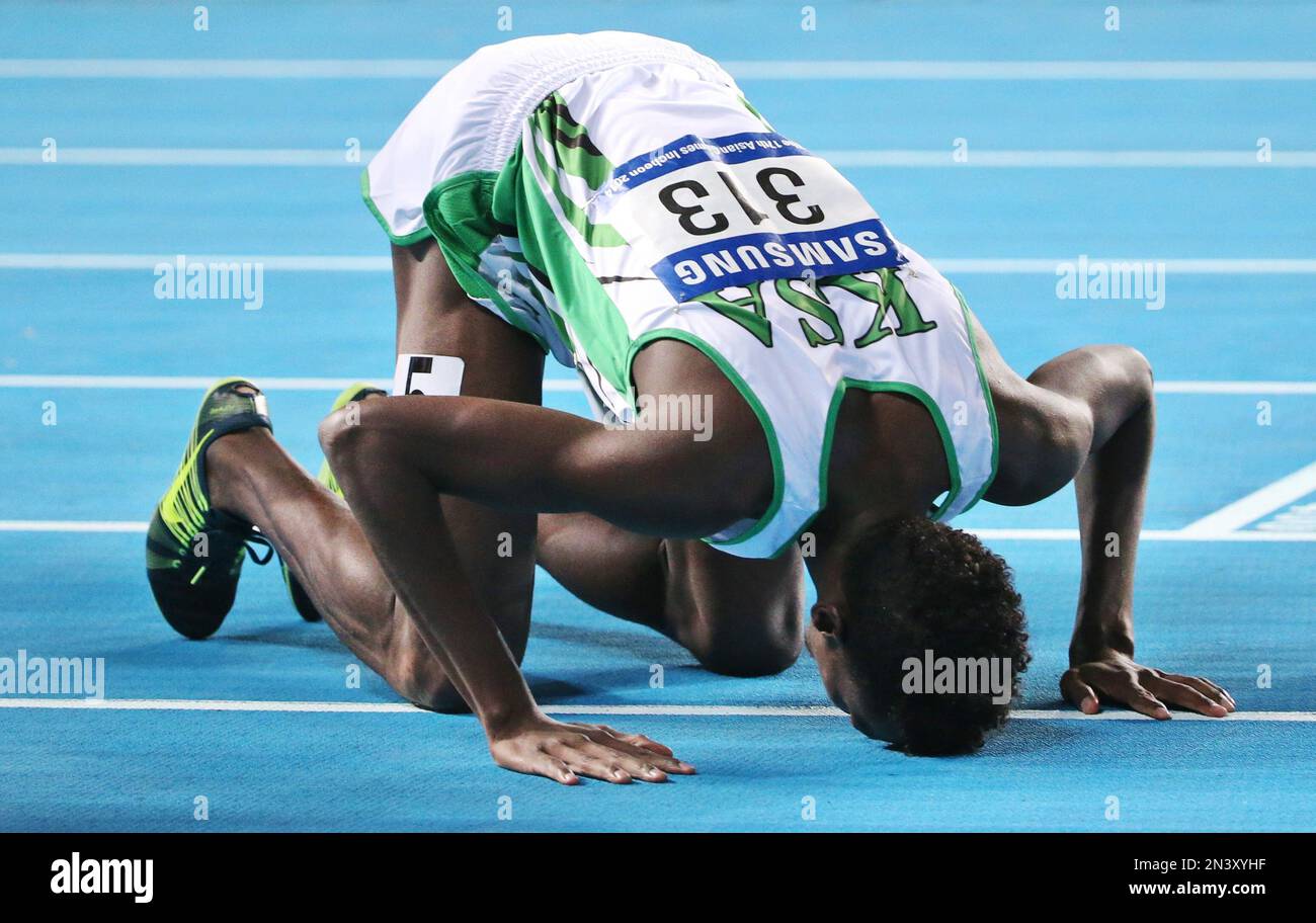 Saudi Arabia's Abdulaziz Ladan Mohammed kisses the track after the men's 800m final at the 17th ...