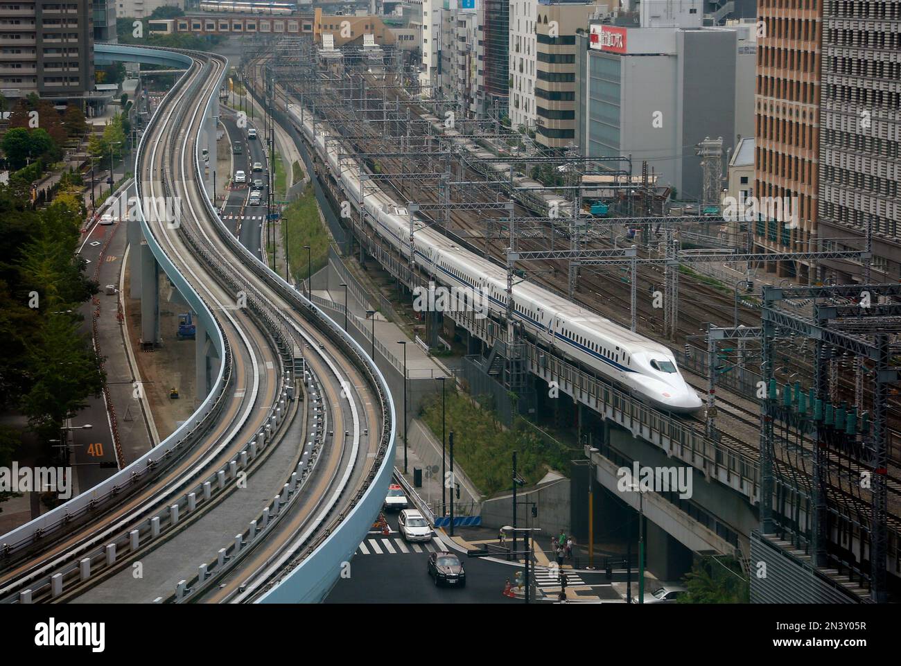 In this Sept. 24, 2014 photo, a Shinkansen bullet train heads for Tokyo ...