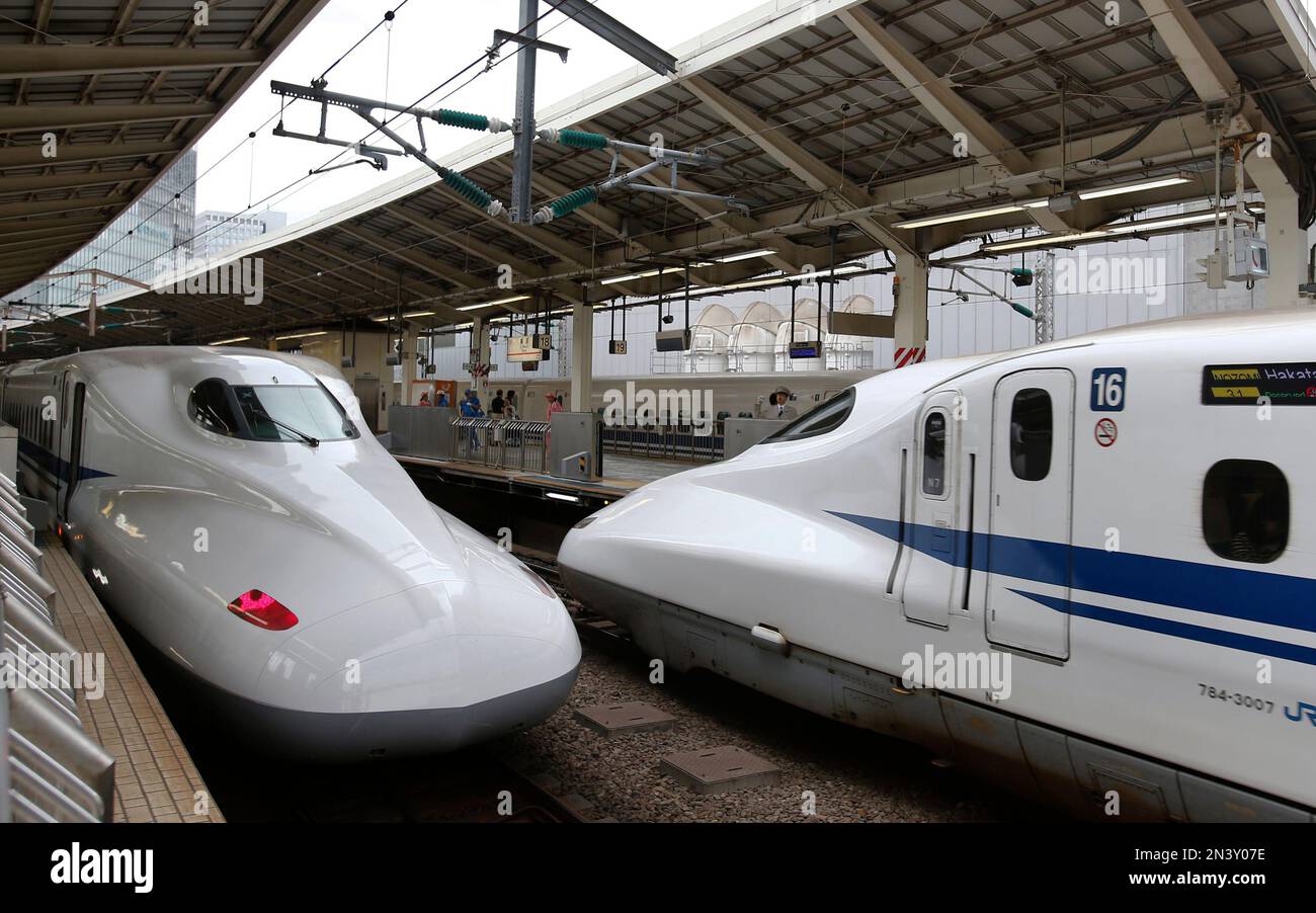 In this Sept. 24, 2014 photo, a Shinkansen bullet train arrives at ...