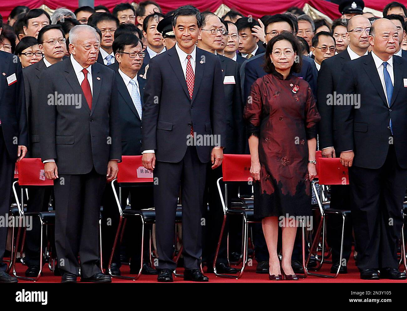 Hong Kong's Chief Executive Leung Chun-ying, center, stands when the ...