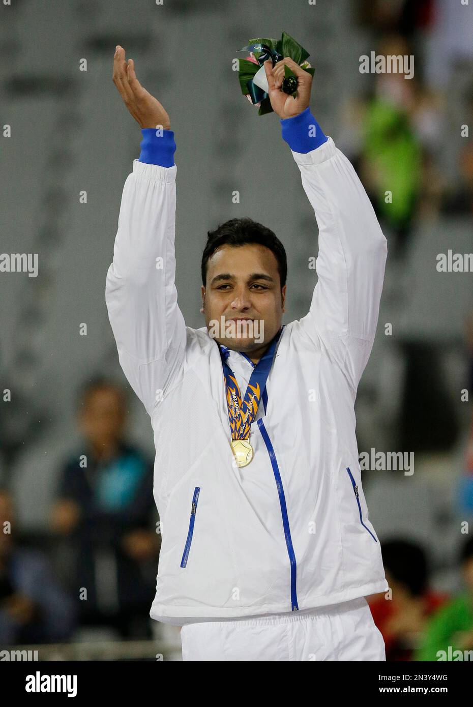 Men's discus throw gold medalist Iran's Ehsan Hadadi waves from the ...