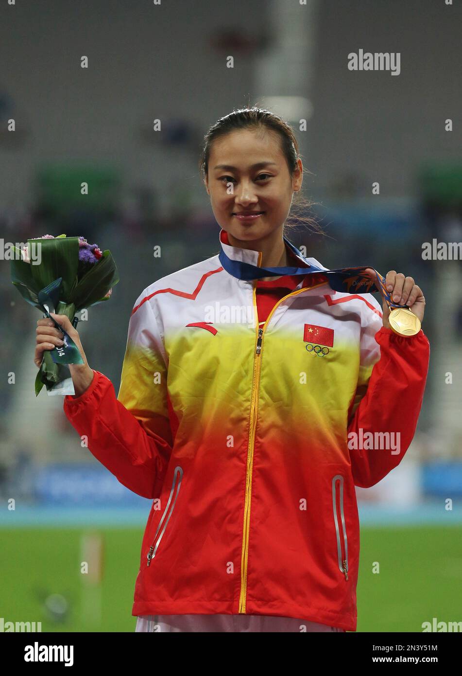 Gold medal winner China’s Li Ling poses during the medal ceremony of ...