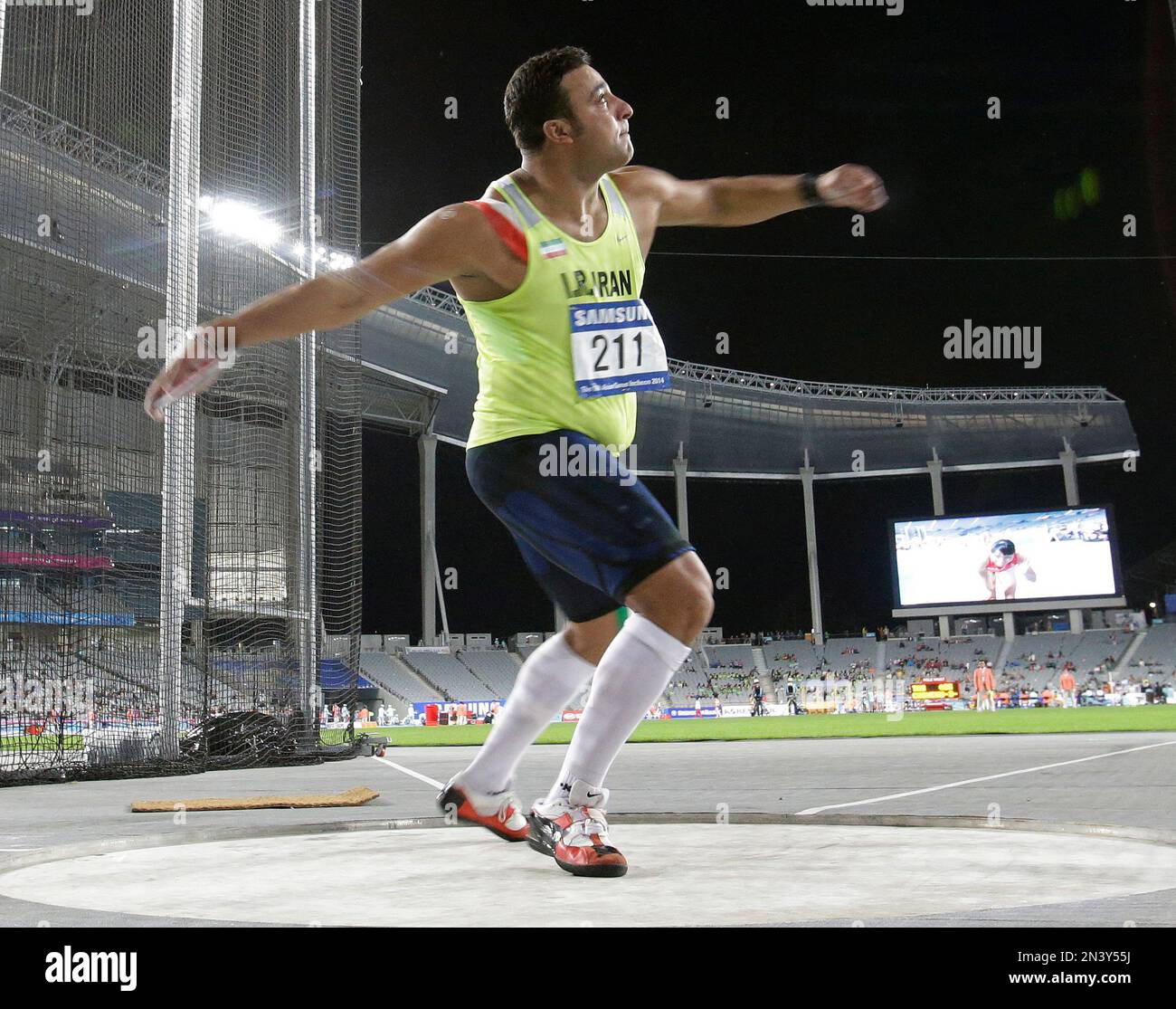 Iran's Ehsan Hadadi competes in men's discus throw final at the 17th ...