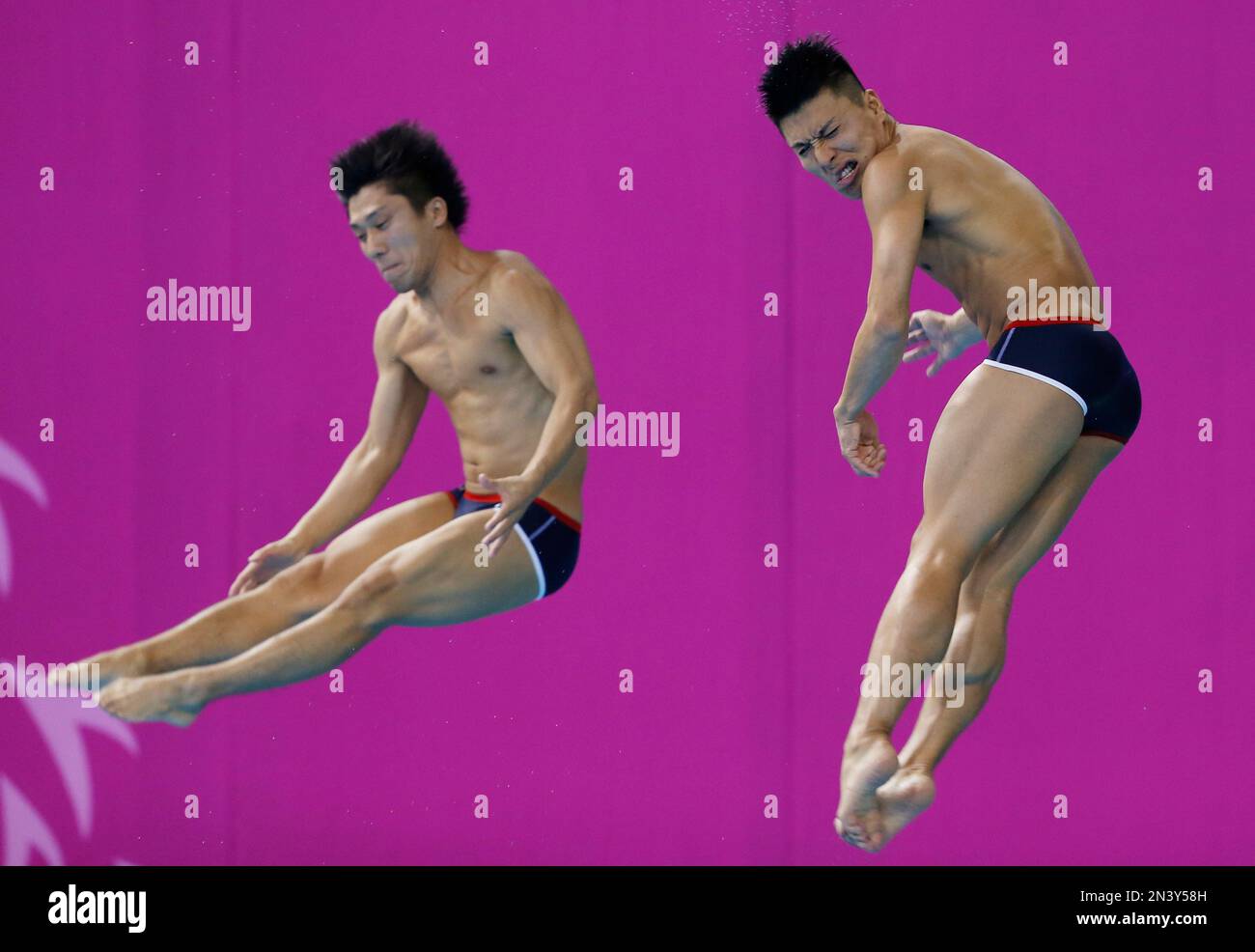 Japan's Yu Okamoto, left and Ken Terauchi compete during the men's ...